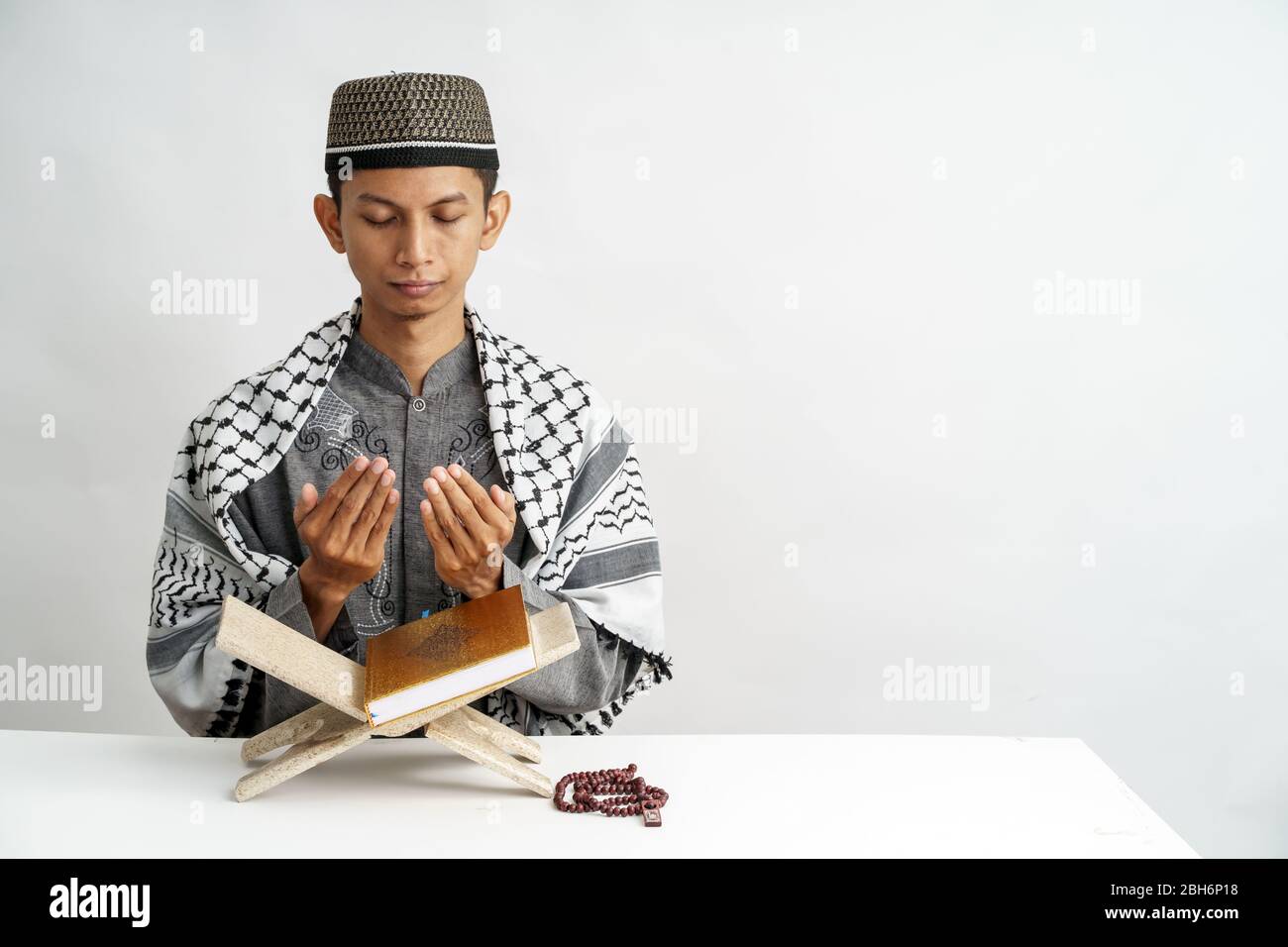 muslim male reading quran over white background. ramadan kareem Stock ...