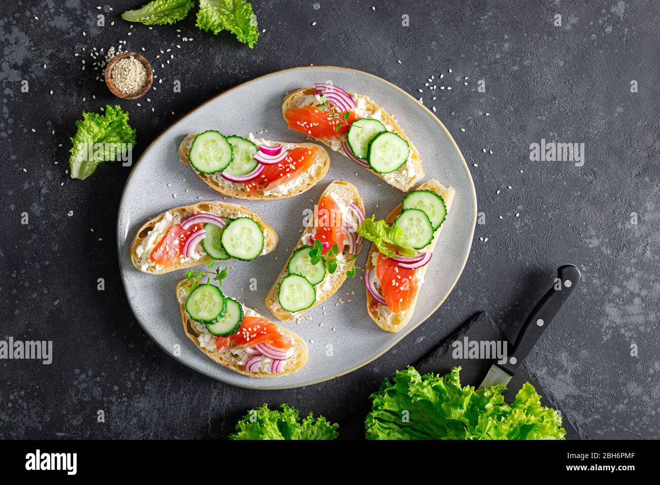 Sandwiches with homemade ciabatta bread, salted salmon fish, feta ...