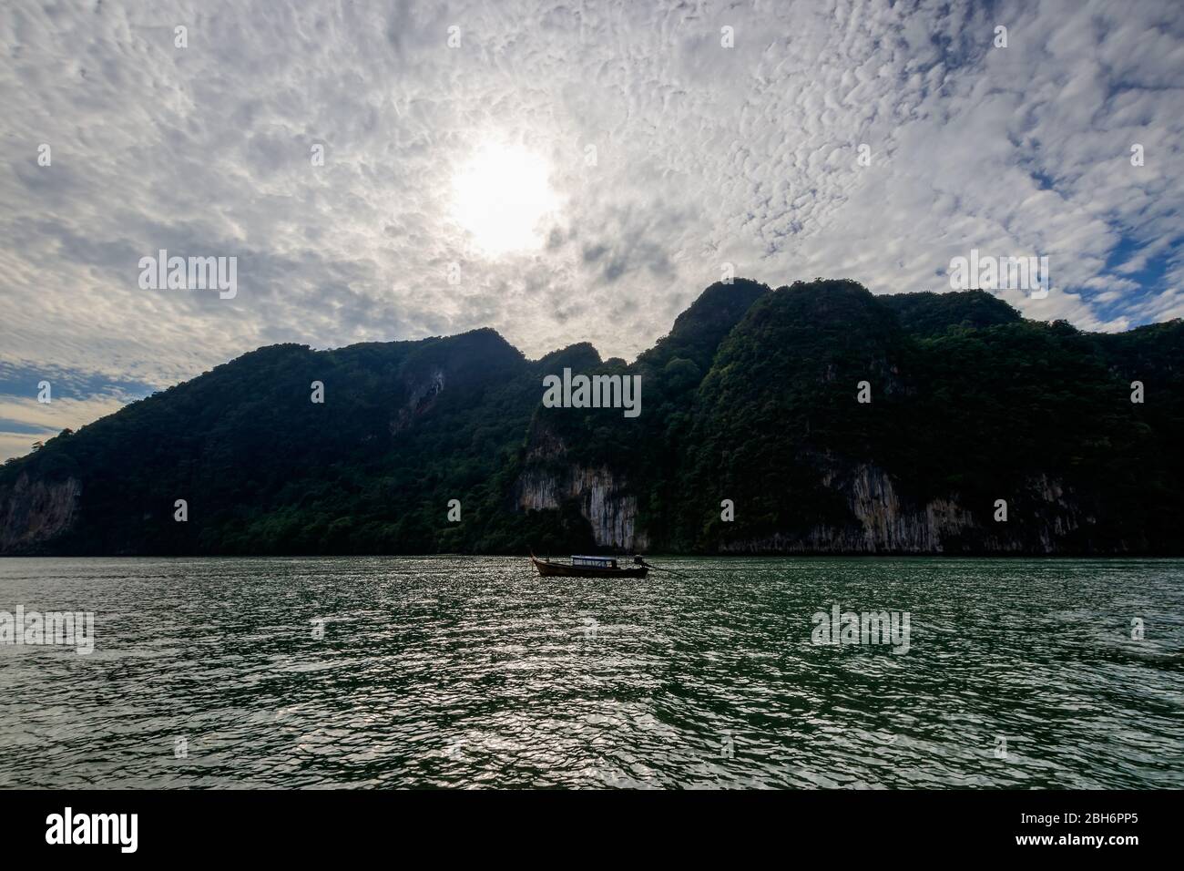 Karst mountains and sea against a blue sky with clouds on a sunny day. Thailand, Phang Nga ...