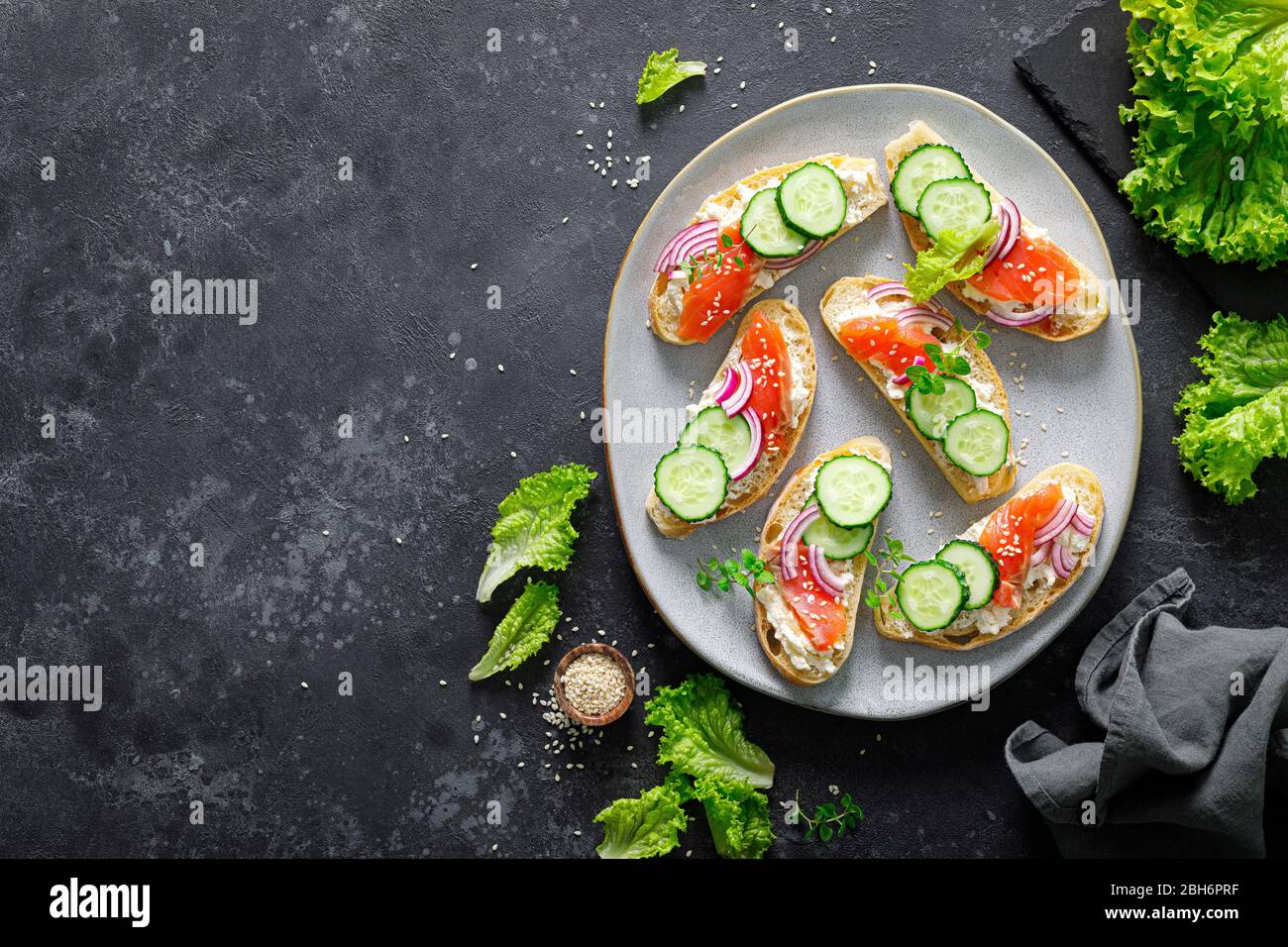 Sandwiches with homemade ciabatta bread, salted salmon fish, feta ...