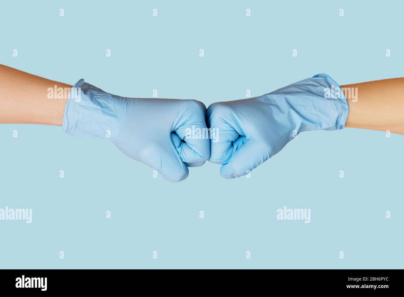 Medical gloves fist bump hi-res stock photography and images - Alamy
