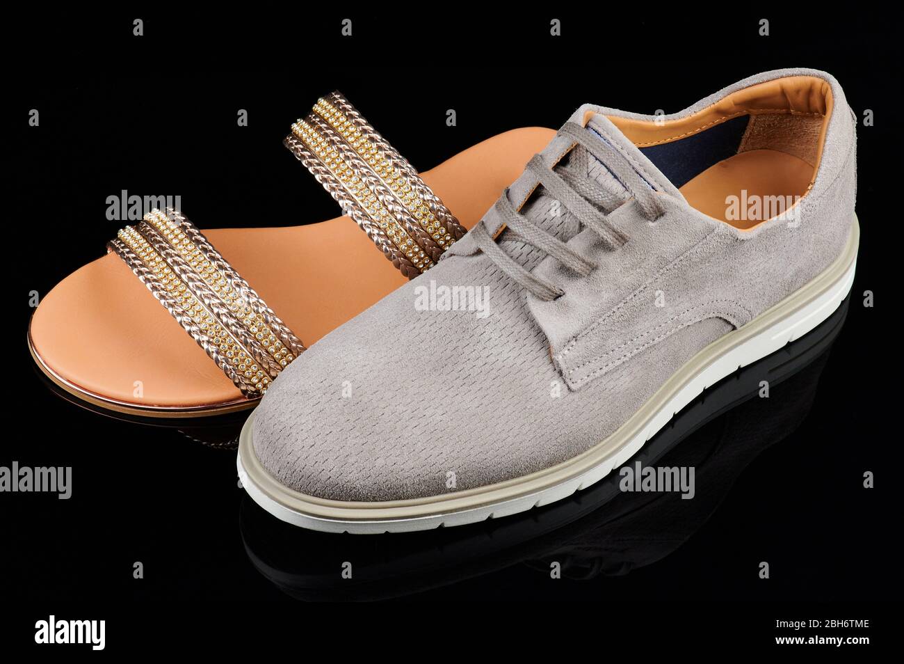 Man and woman shoe side view isolated on black background Stock Photo ...