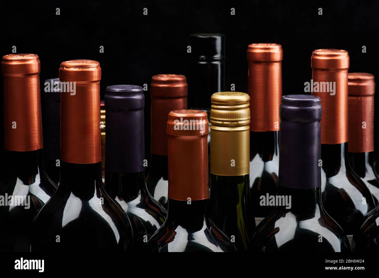 Stacked wine bottle background isolated on black background Stock Photo ...