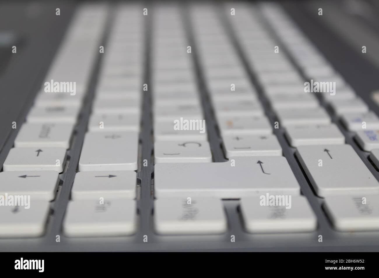grey laptop keyboard with white keys Stock Photo - Alamy