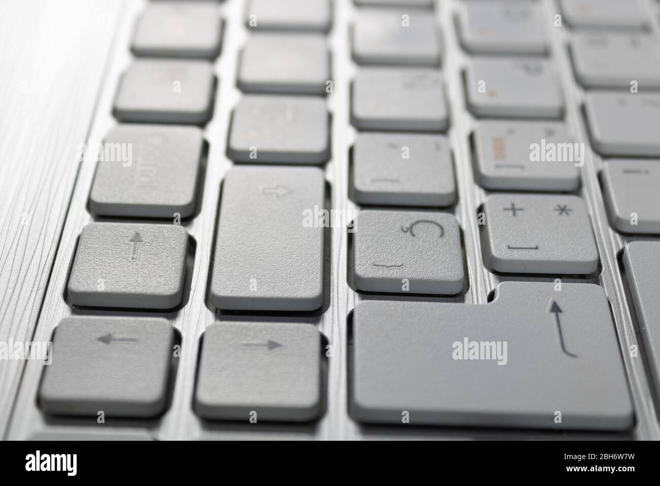 grey laptop keyboard with white keys Stock Photo - Alamy
