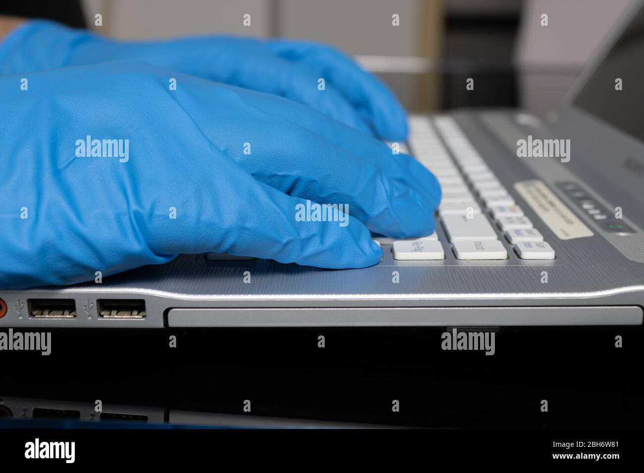 Computer keyboard hands gloves typing hi-res stock photography and ...