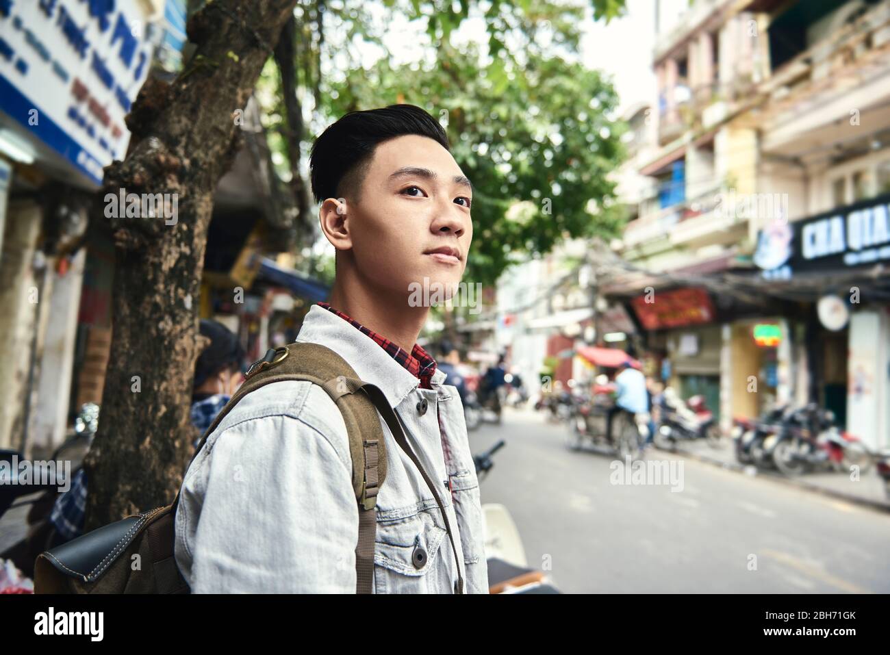Male tourist exploring the city Stock Photo - Alamy