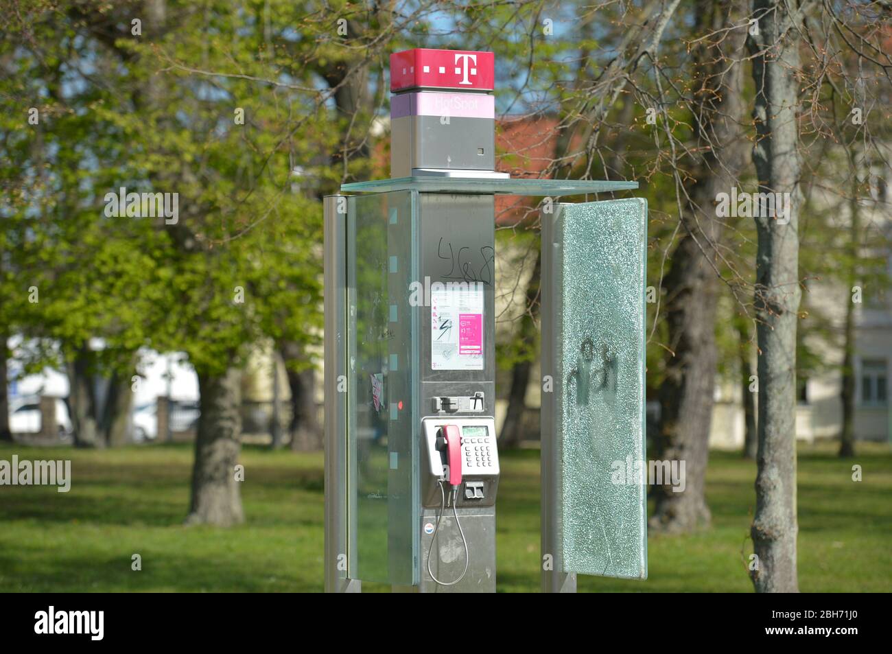 Grimma, Germany. 16th Apr, 2020. The safety glass of a telephone booth ...