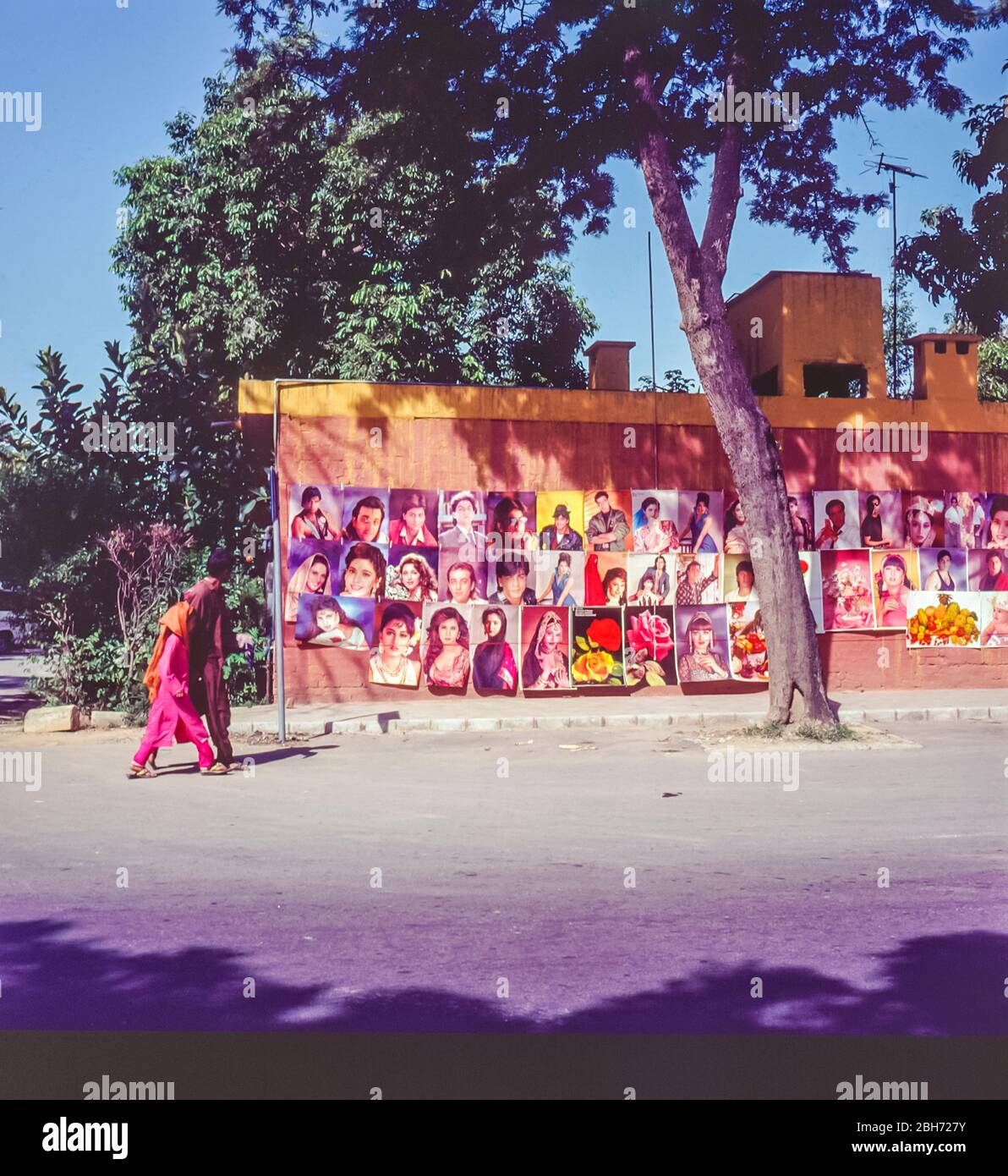 Pakistan, Islamabad street scene with a couple of ladies in very ...