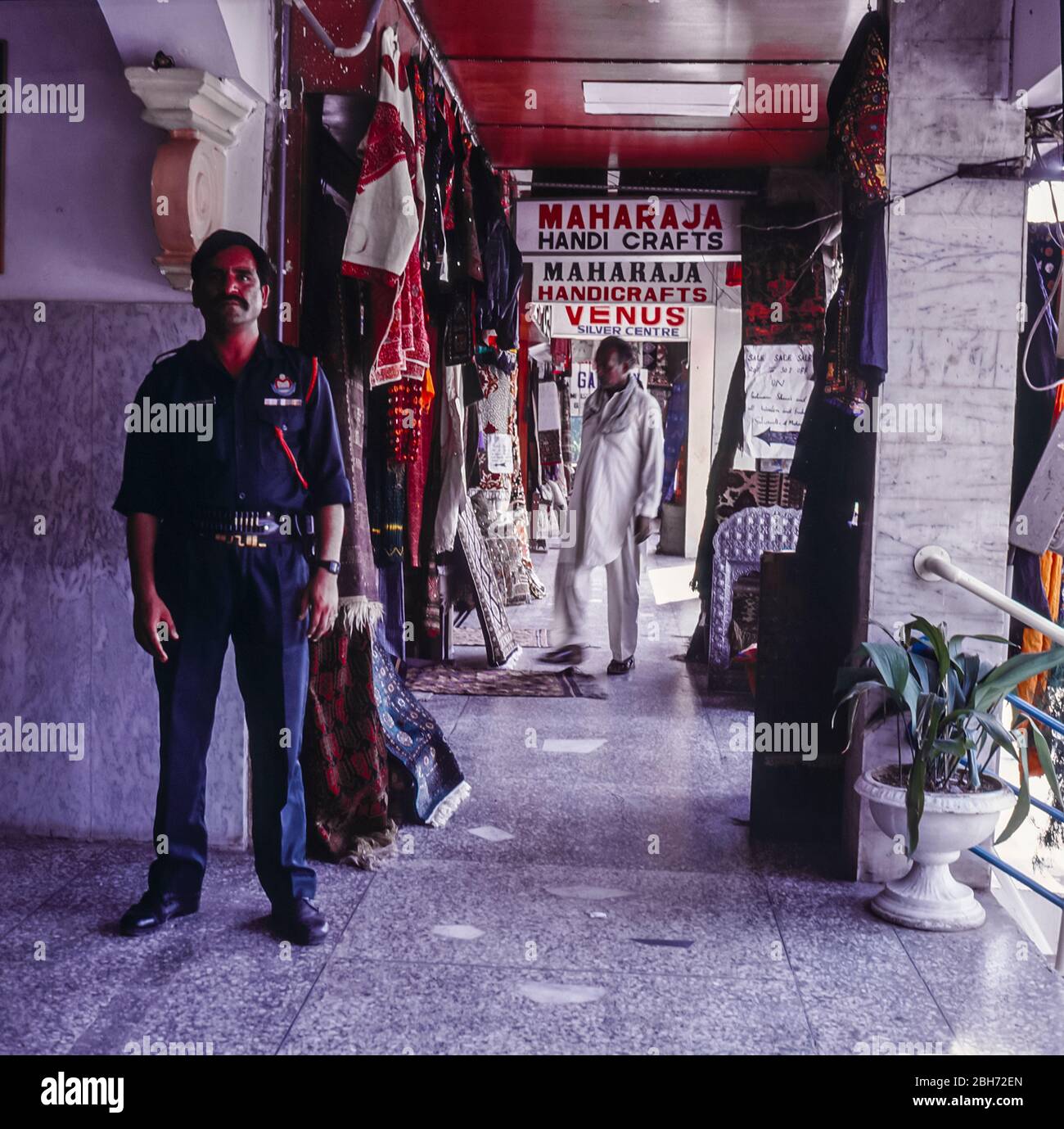 Pakistan, Islamabad, Security guard at one of Islamabad's shopping Mall ...