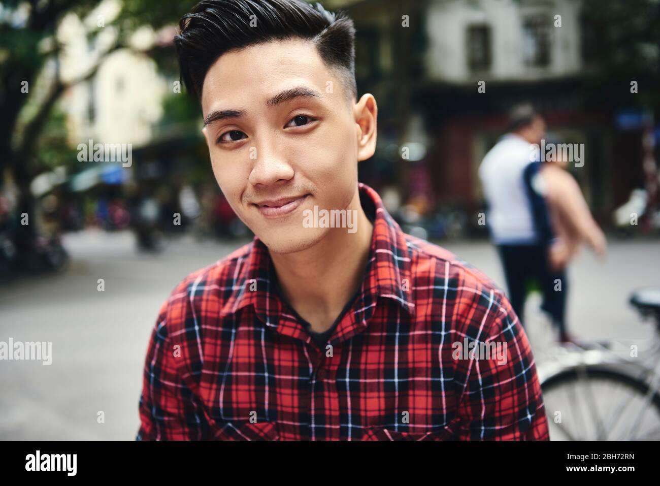 Portrait of young Vietnamese man in the city Stock Photo - Alamy