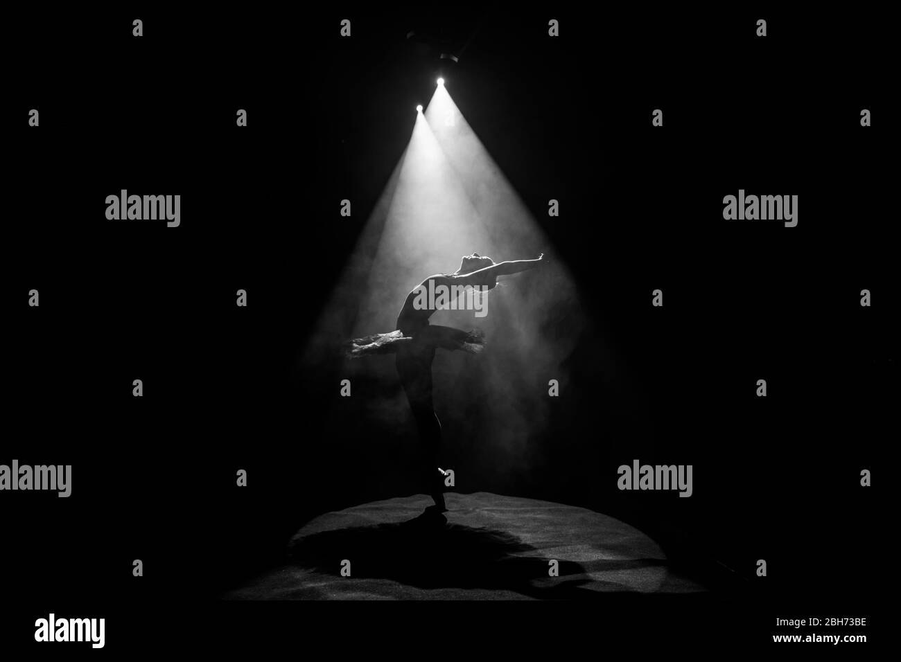 Ballerina Ballet dancer on stage with spotlight black and white Stock ...
