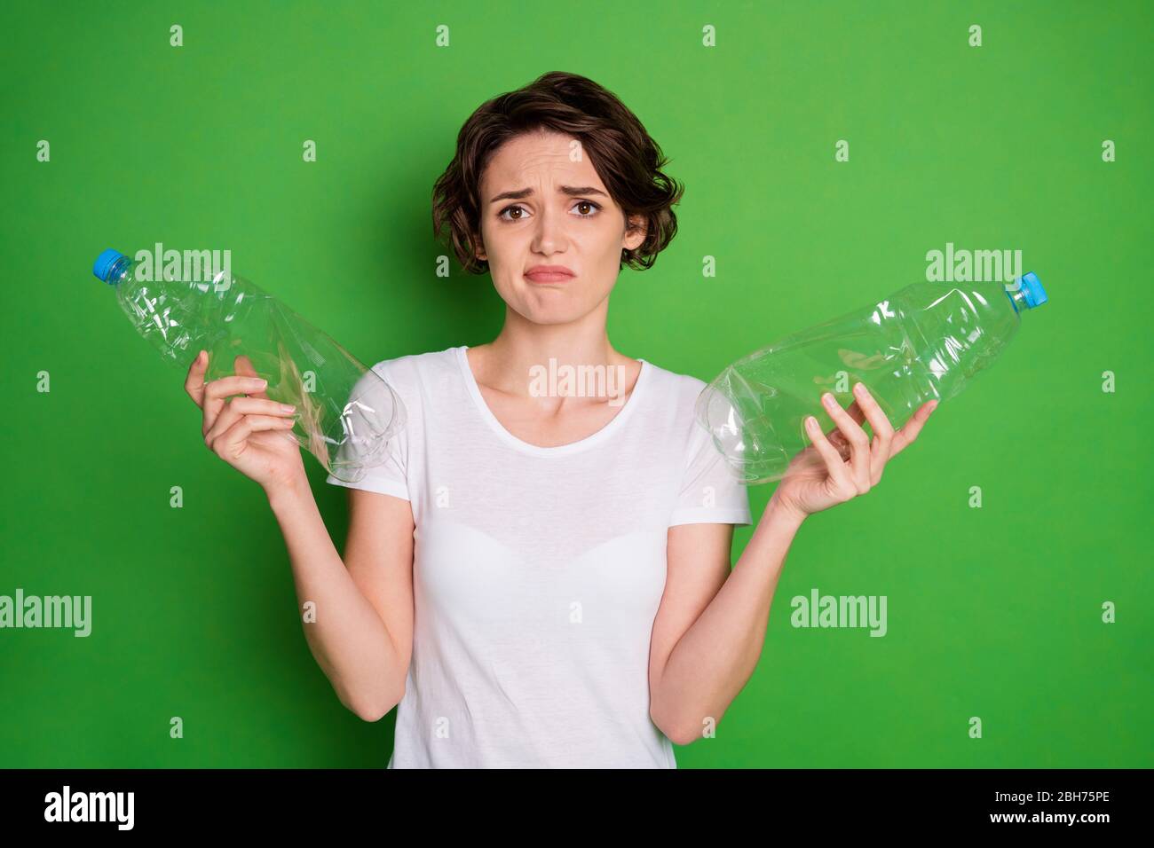 Collect garbage concept. Photo of beautiful lady hold plastic bottles ...