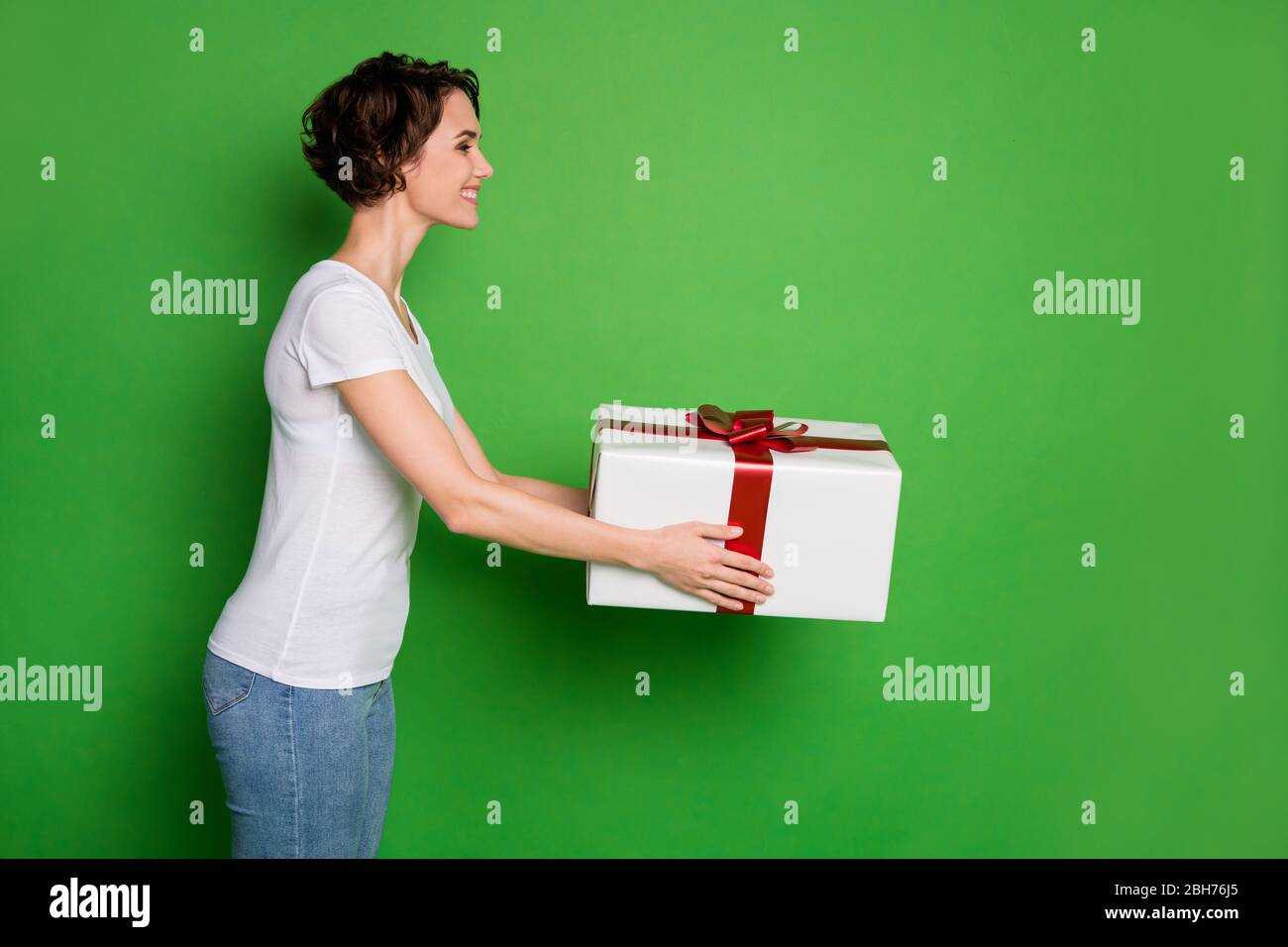 Profile photo of beautiful lady wavy short hairdo hold large giftbox ...