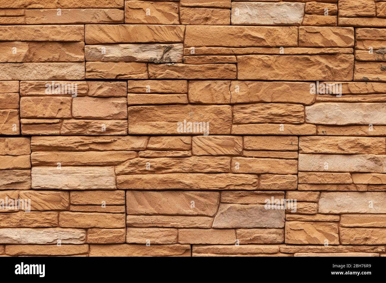 Front brickwork of orange brick. Modern materials for building a house ...