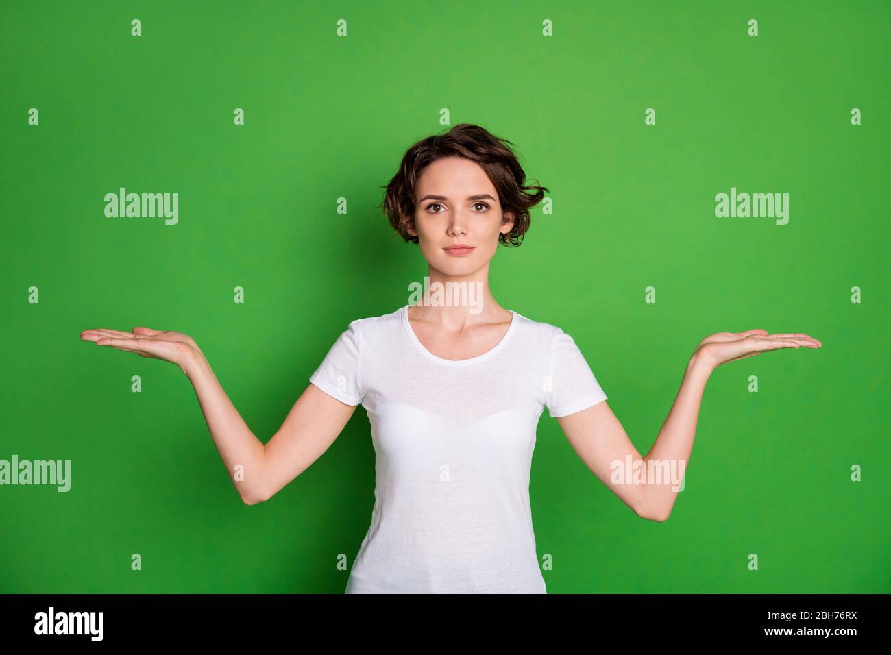 Photo of attractive lady wavy hairdo holding two open arms empty space ...
