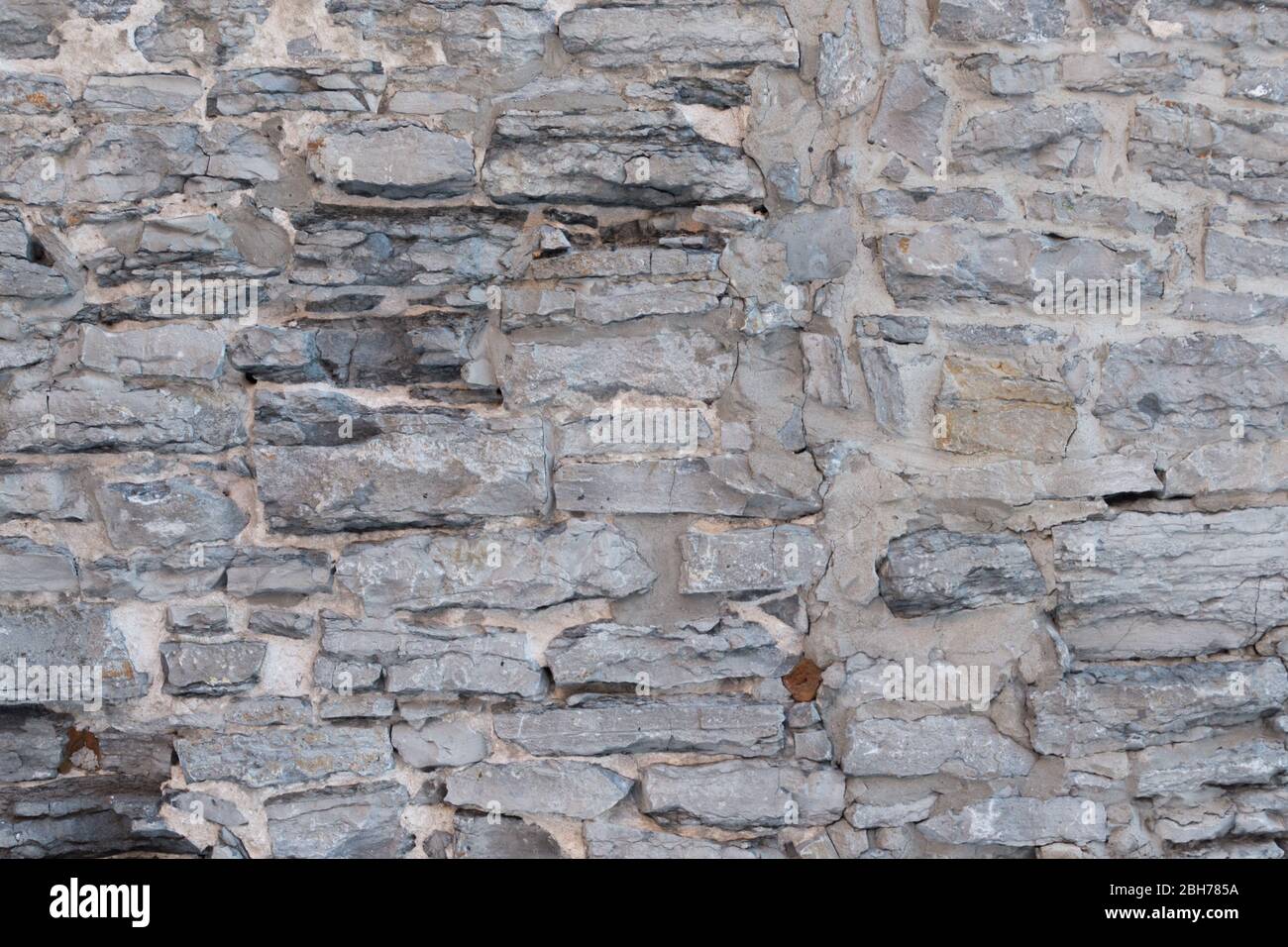 Textured natural wallpaper of limrestone stone wall and grout Stock ...