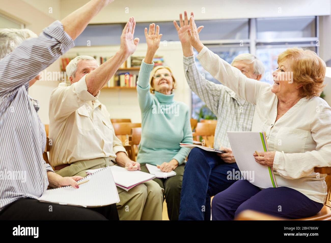 Seniors practice cohesion in group therapy with their hands Stock Photo ...