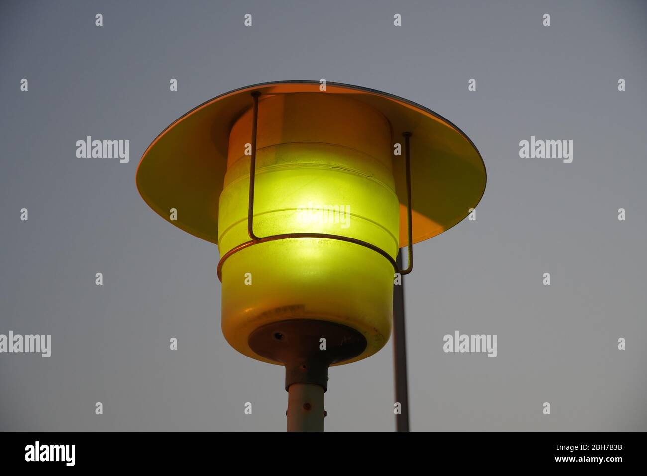Street Lamp post with the evening skyline view. Outdoor light fixture ...