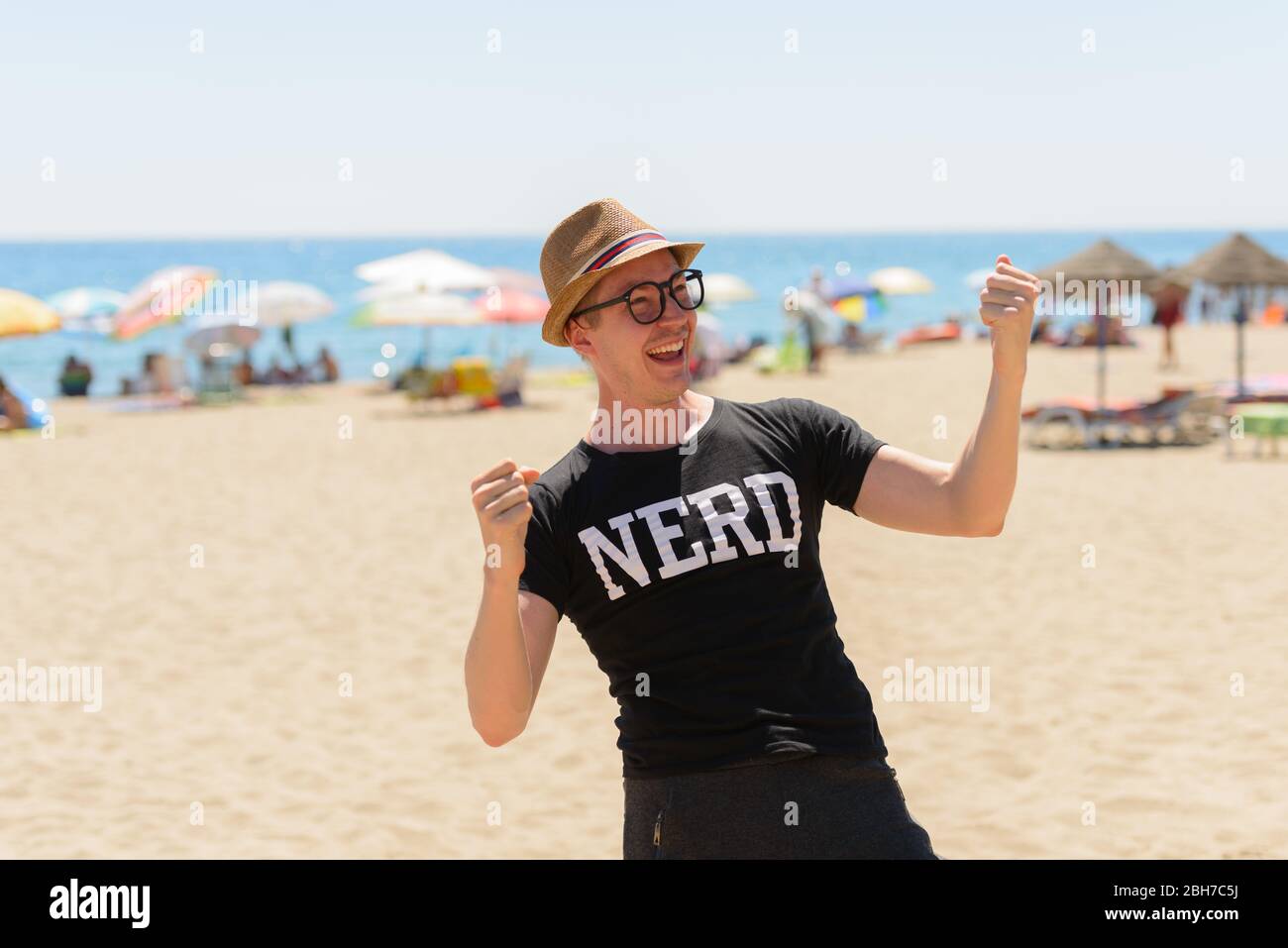 Happy man at the beach hi-res stock photography and images - Alamy