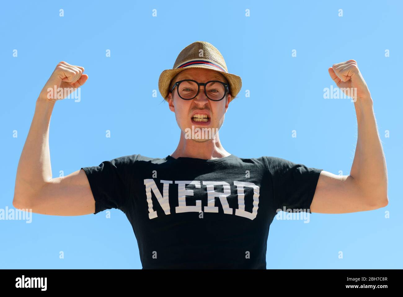 Nerd flexing arm hi-res stock photography and images - Alamy