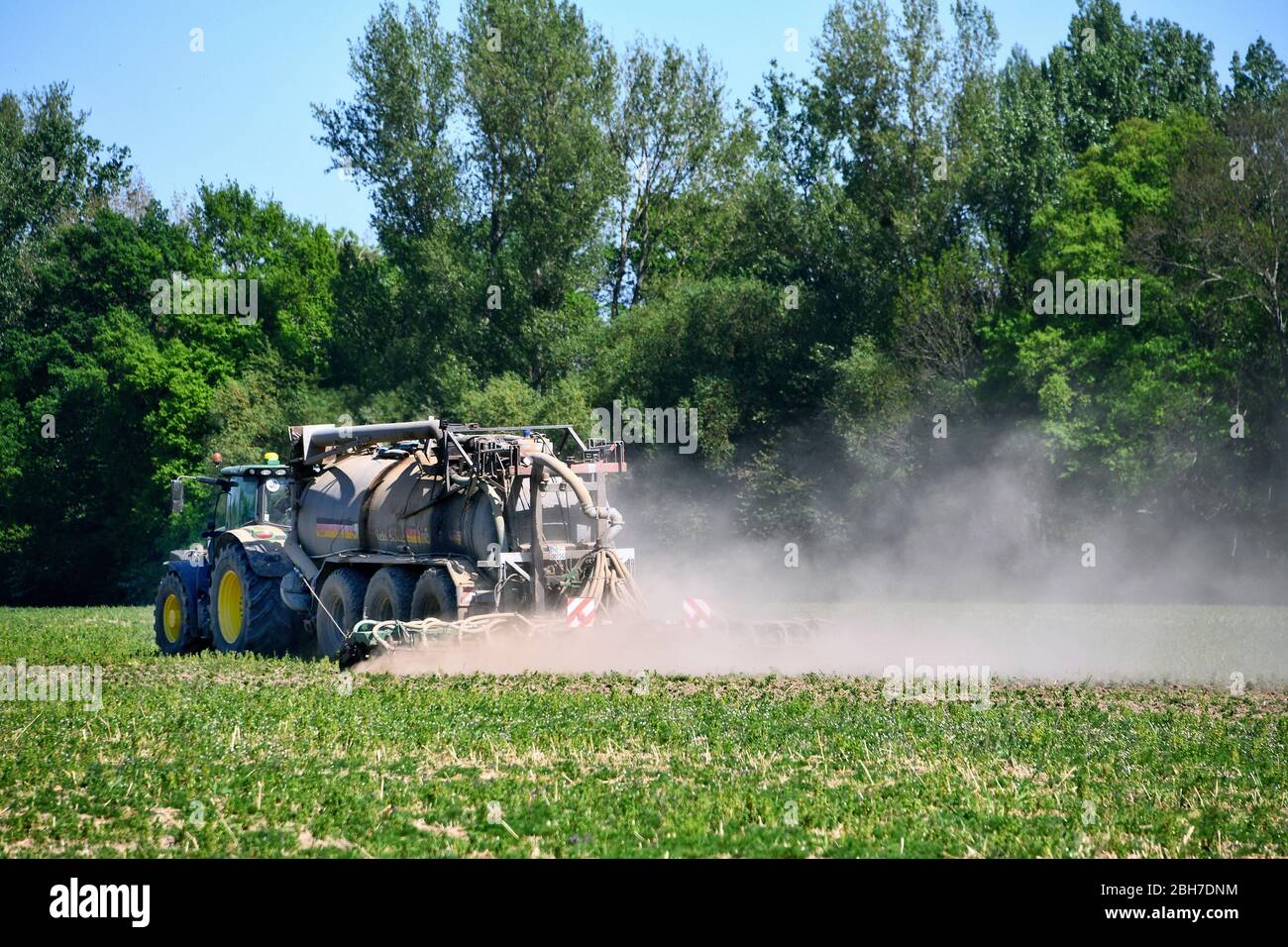 Farmer fertilizes a dry field with his tractor near Neuss, Northrhine ...
