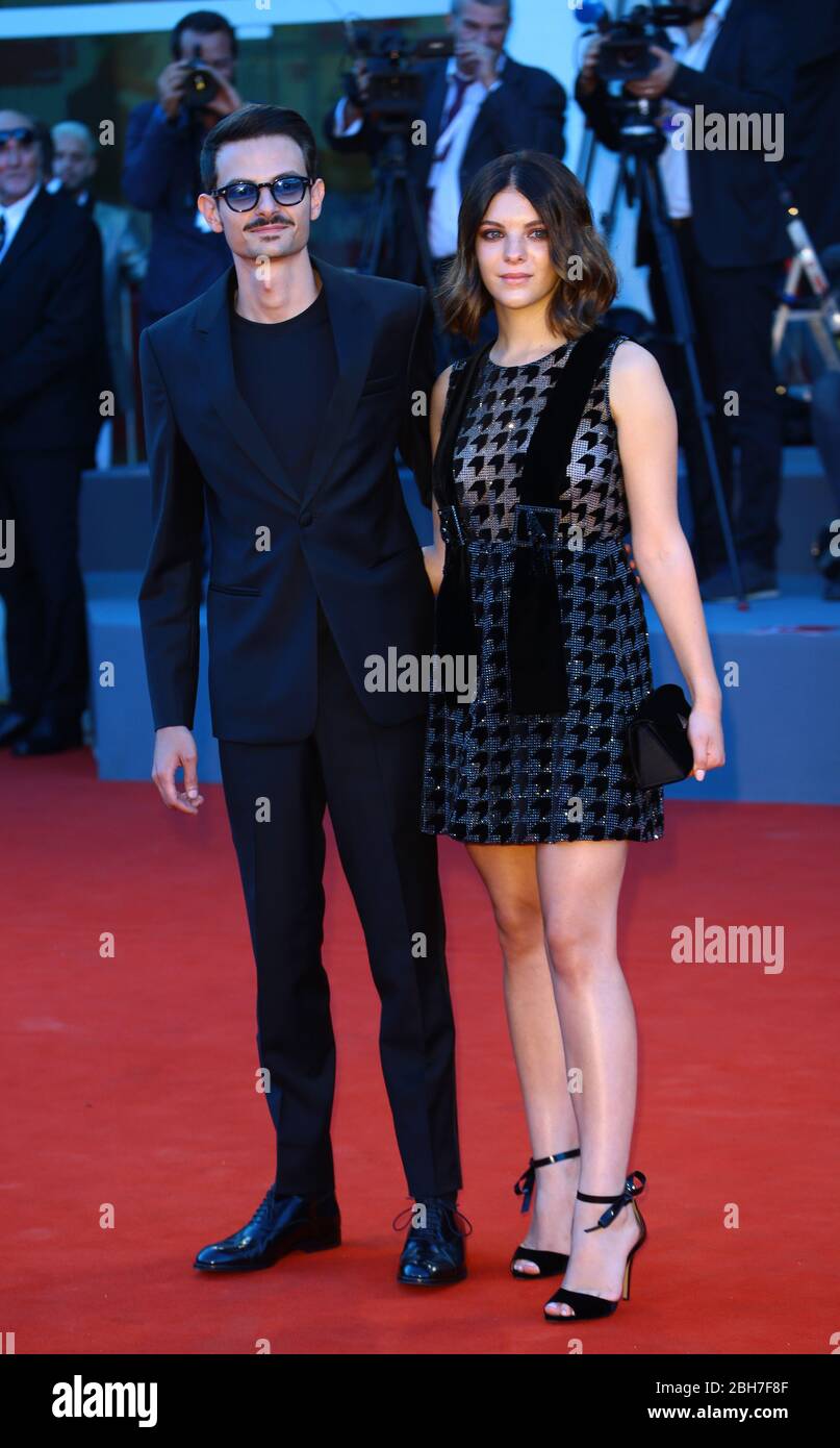 VENICE, ITALY - SEPTEMBER 04: Fabio Rovazzi and Karina Bezhenar walks ...