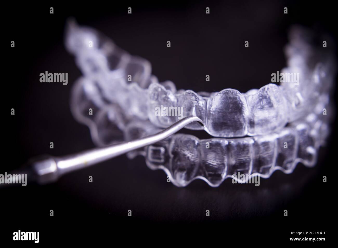 Transparent plastic dental retainer teeth alignment corrector with ...