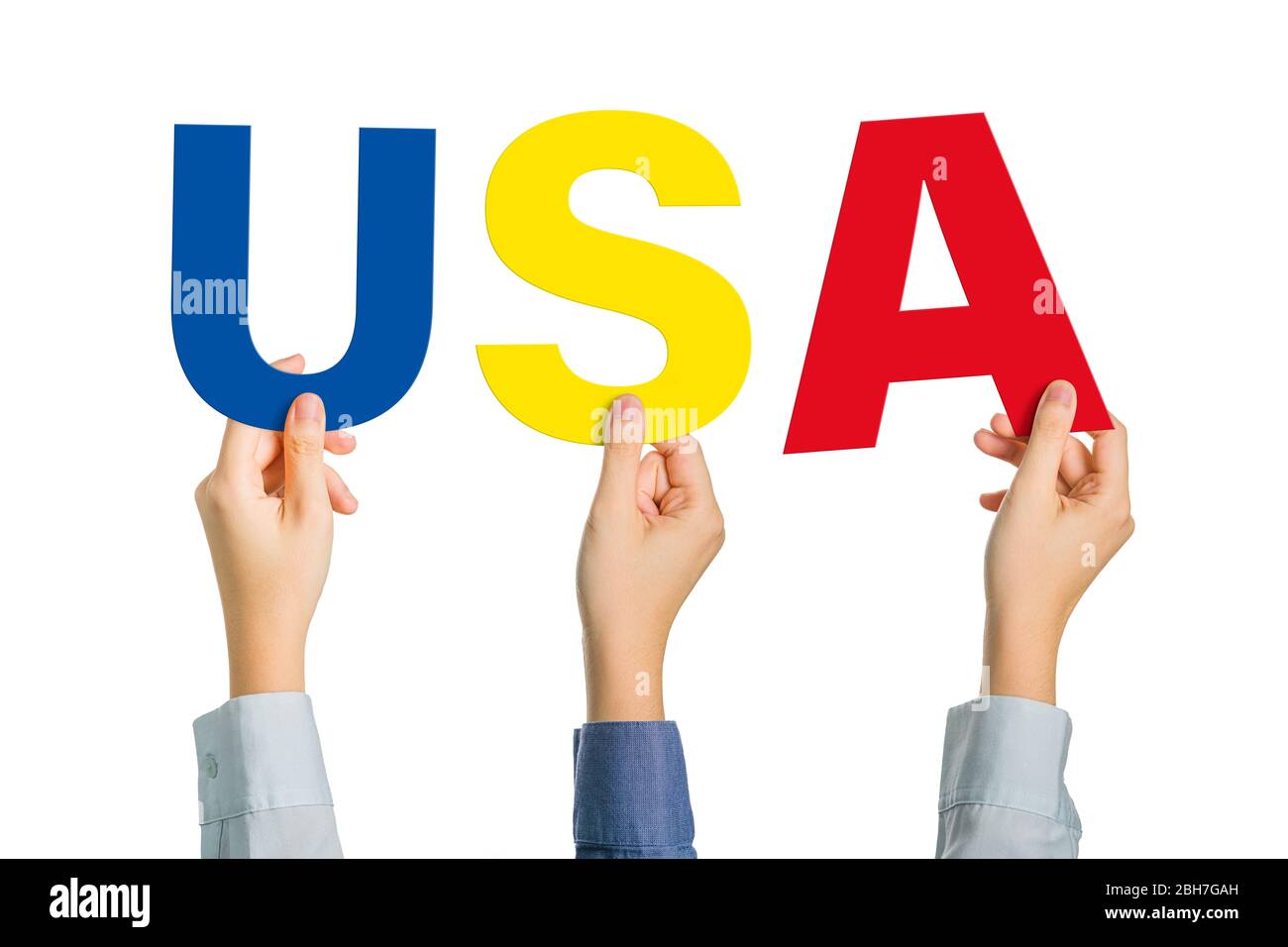 Multiple hands holding colored alphabets to form the word Hello on ...