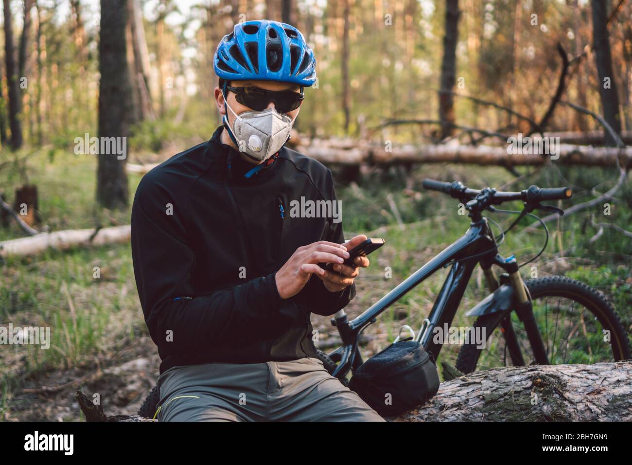 Male cyclist wearing respirator face mask with heavy duty protective ...