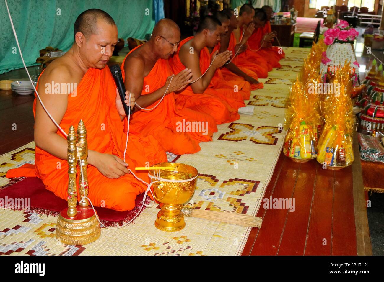 A head of monk is making the holy water in the buddhism procession. Hua ...
