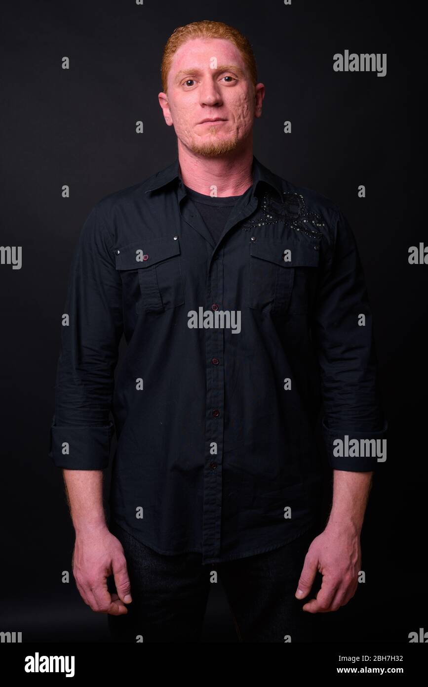 Portrait of muscular man with orange hair Stock Photo - Alamy