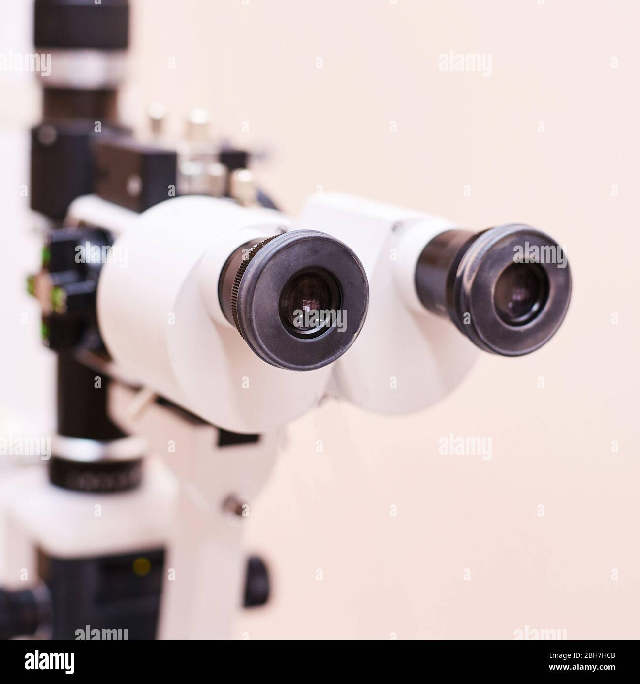 ophthalmologist doctor in exam optician laboratory with female patient ...