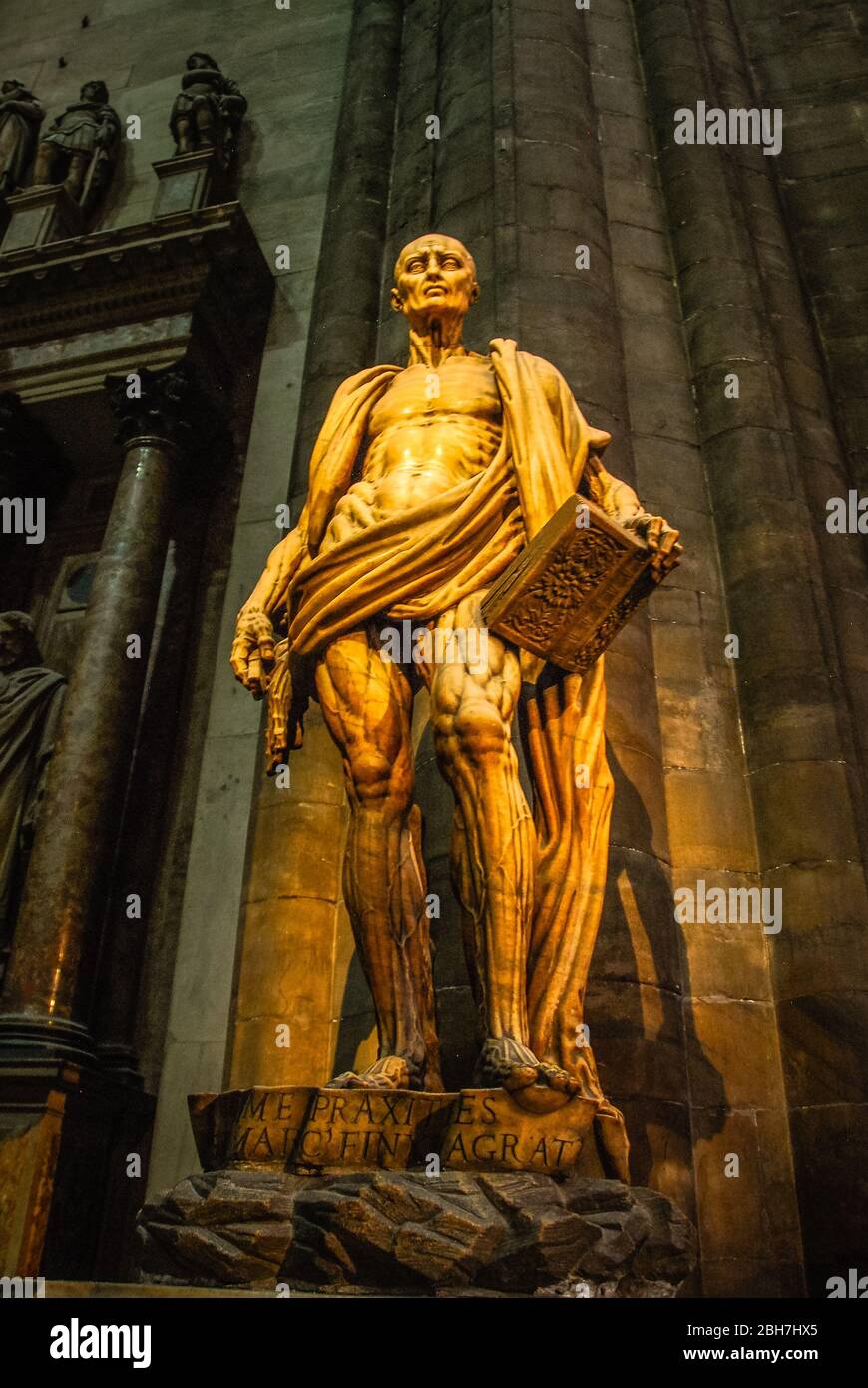 Statue of St. Bartholomew, carrying his own skin around his body inside ...