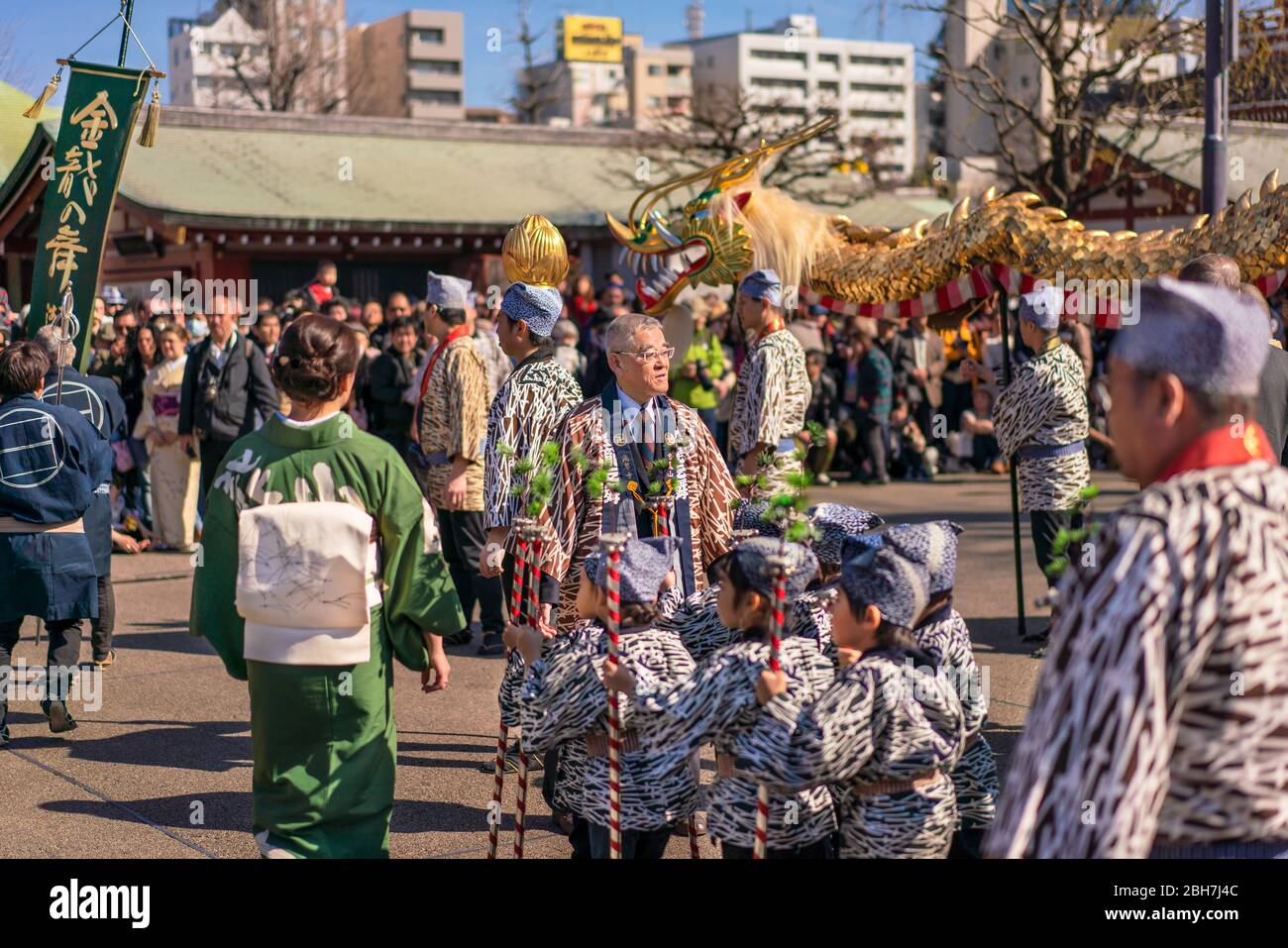 tokyo, japan - march 18 2020: Japanese children walking in row holding ...