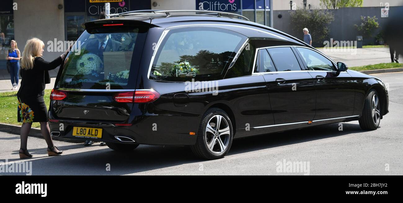 Patsy Large rests her hand on the hearse carrying her husband, comedy ...