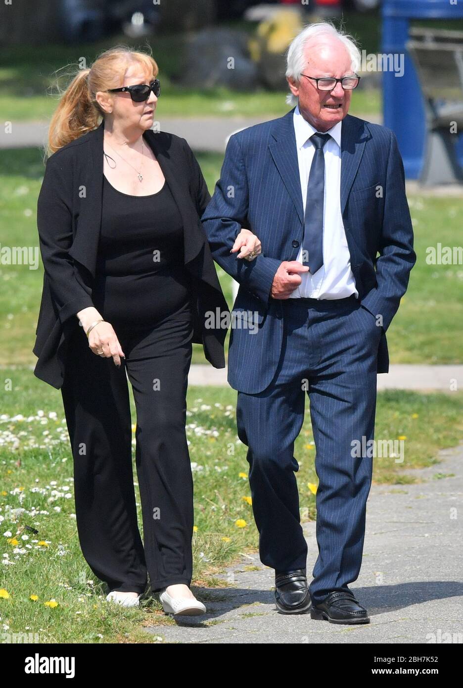 Syd Little and his wife, Sheree, arrive to see the hearse containing ...