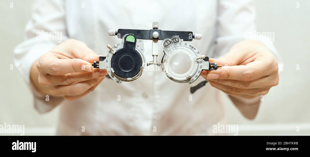 ophthalmologist doctor in exam optician laboratory with female patient ...