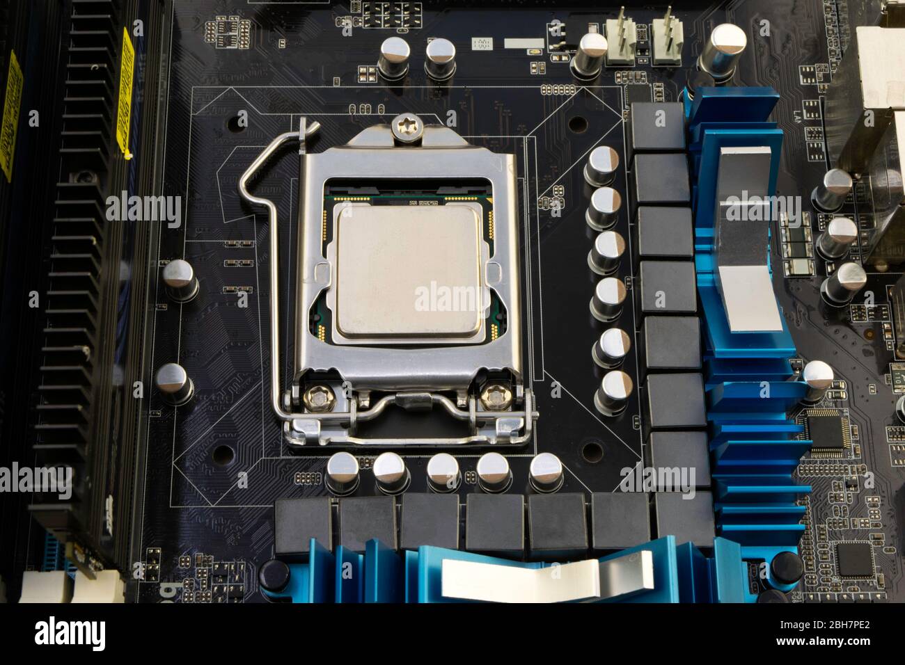 computer motherboard, with processor and other parts installed on it ...