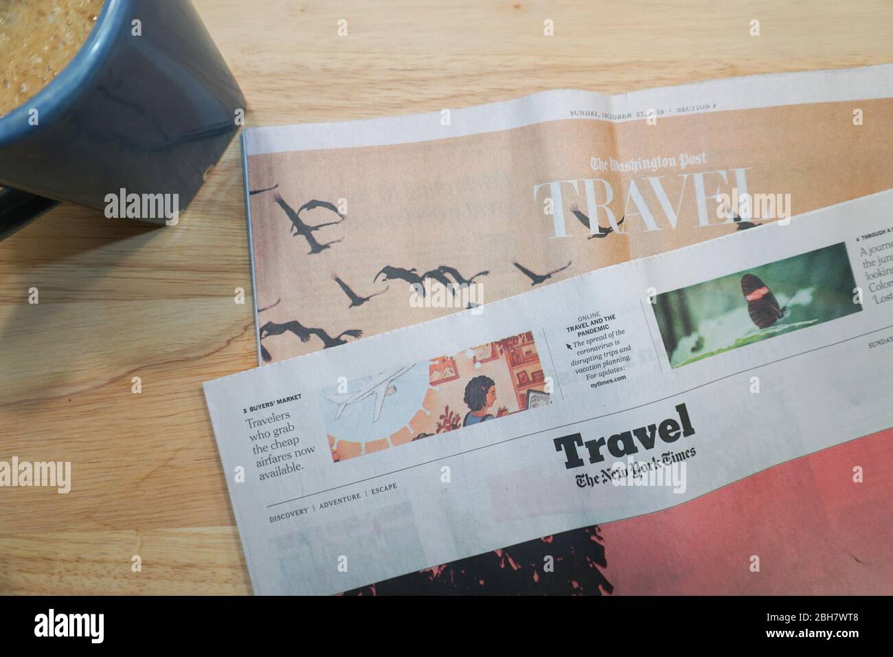 Travel section of the newspaper and a cup of coffee Stock Photo - Alamy