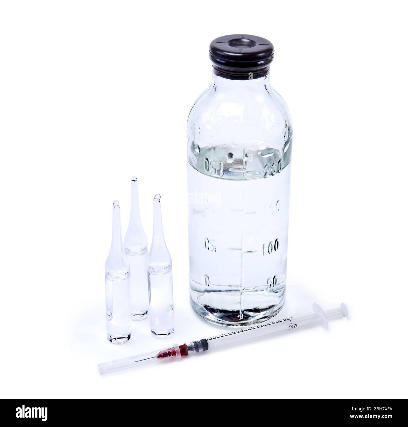 glass sealed medical ampoules with clear liquid, saline bottle, and ...