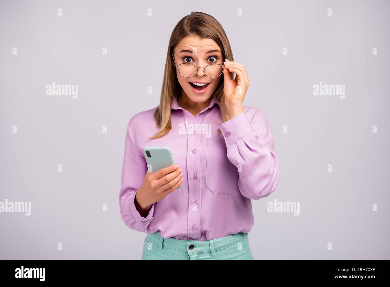 Portrait of astonished crazy girl use smartphone impressed social ...