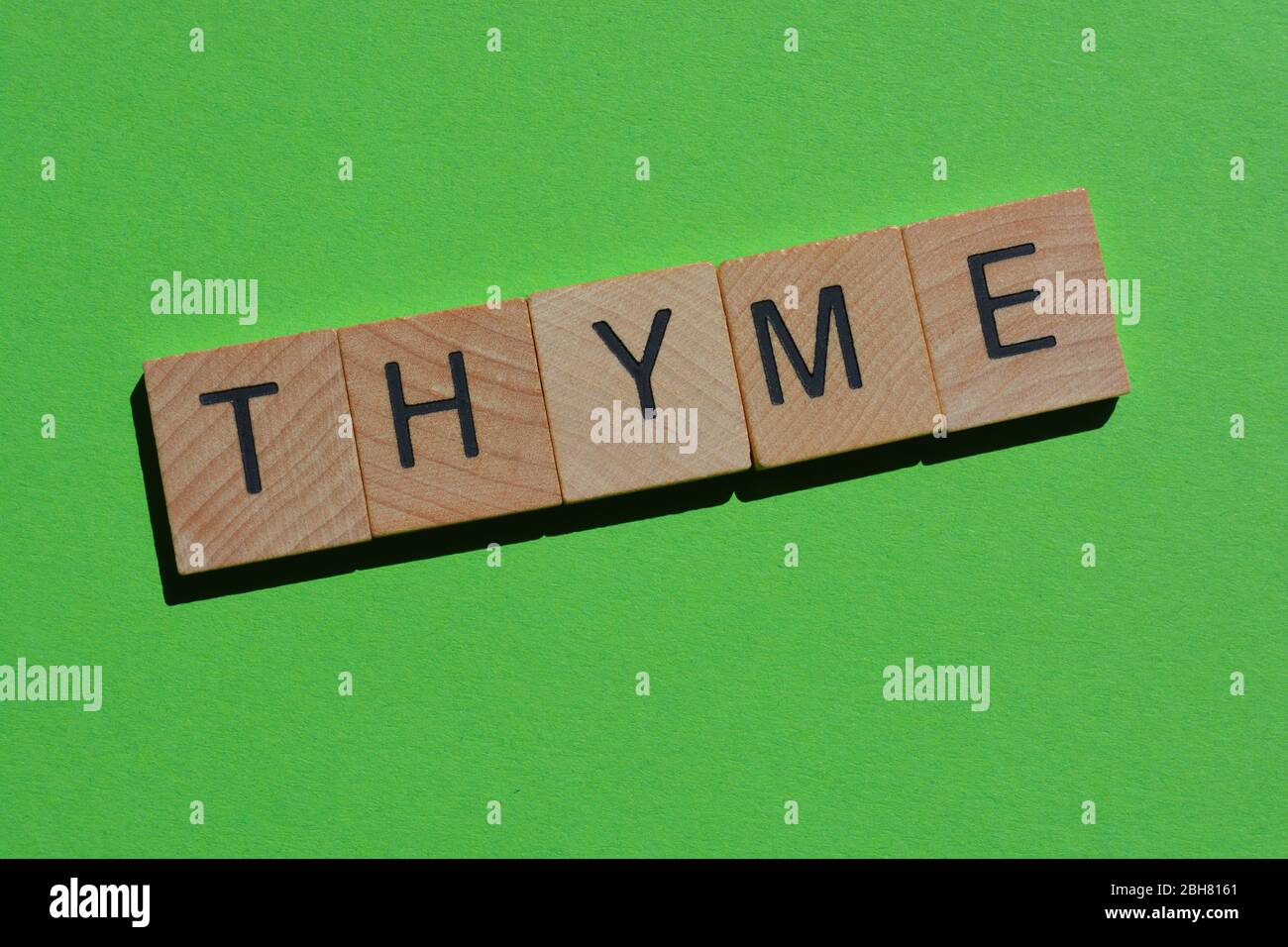 Thyme, word in wood alphabet letters on green Stock Photo - Alamy