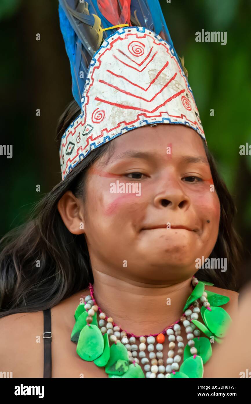 Peruvian girls dressed in traditional celebratory garb meet visitors ...