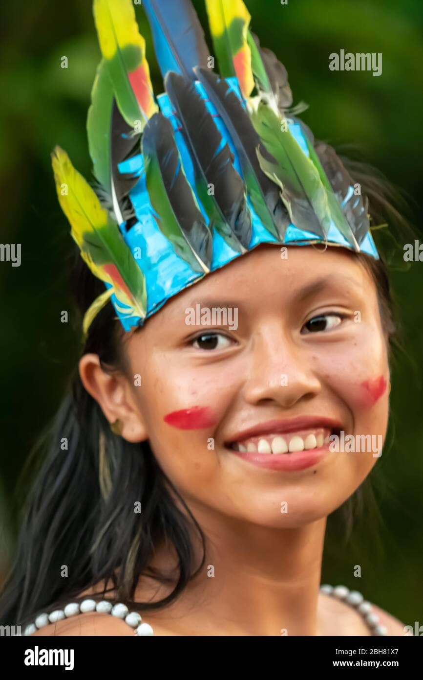 Peruvian girls dressed in traditional celebratory garb meet visitors ...