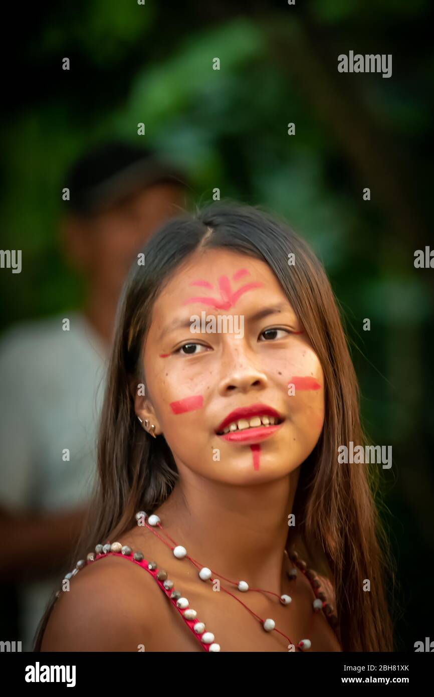 Peruvian girls dressed in traditional celebratory garb meet visitors ...