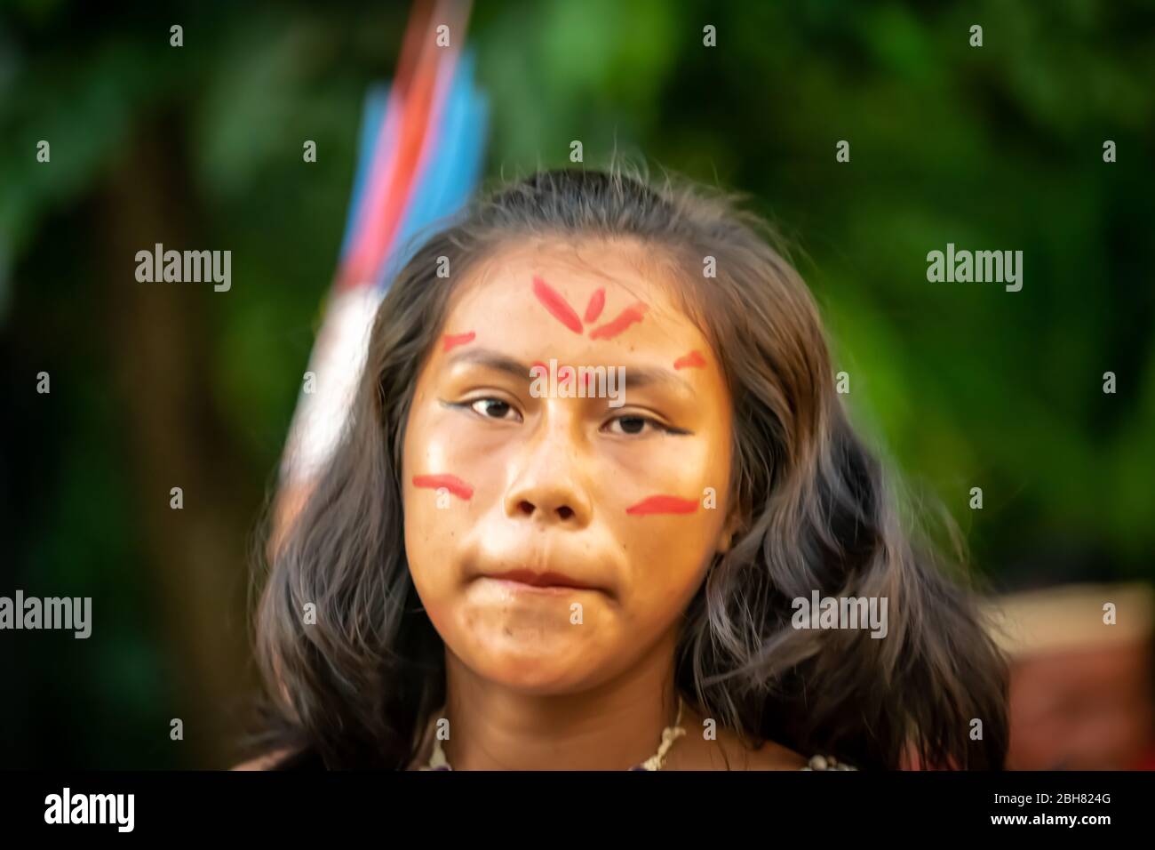 Peruvian girls dressed in traditional celebratory garb meet visitors ...