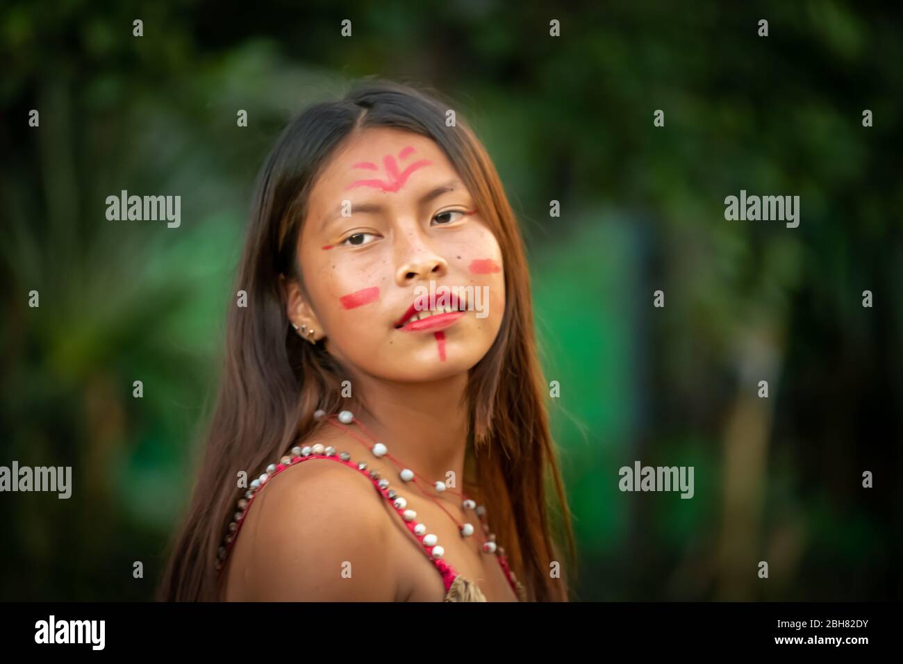 Peruvian girls dressed in traditional celebratory garb meet visitors ...