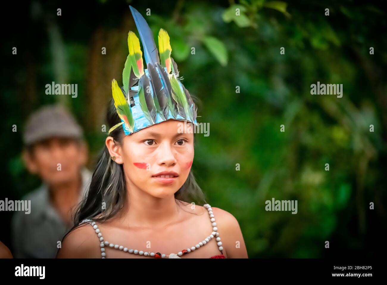 Peruvian girls dressed in traditional celebratory garb meet visitors ...