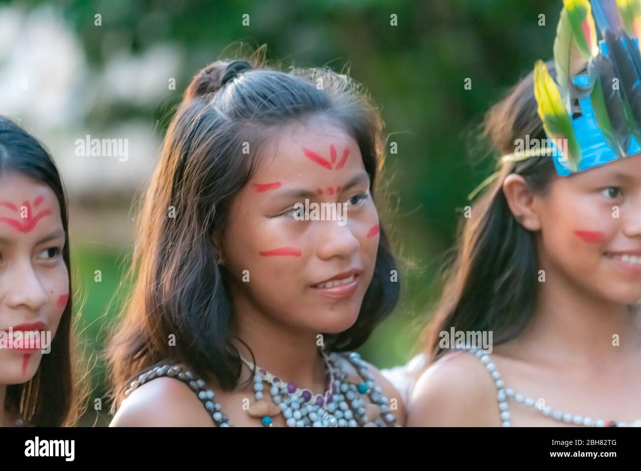 Peruvian girls dressed in traditional celebratory garb meet visitors ...